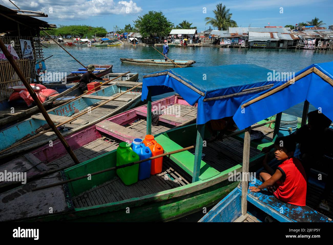 San Jose, Philippines - May 2022: People crossing the Pandurucan River ...