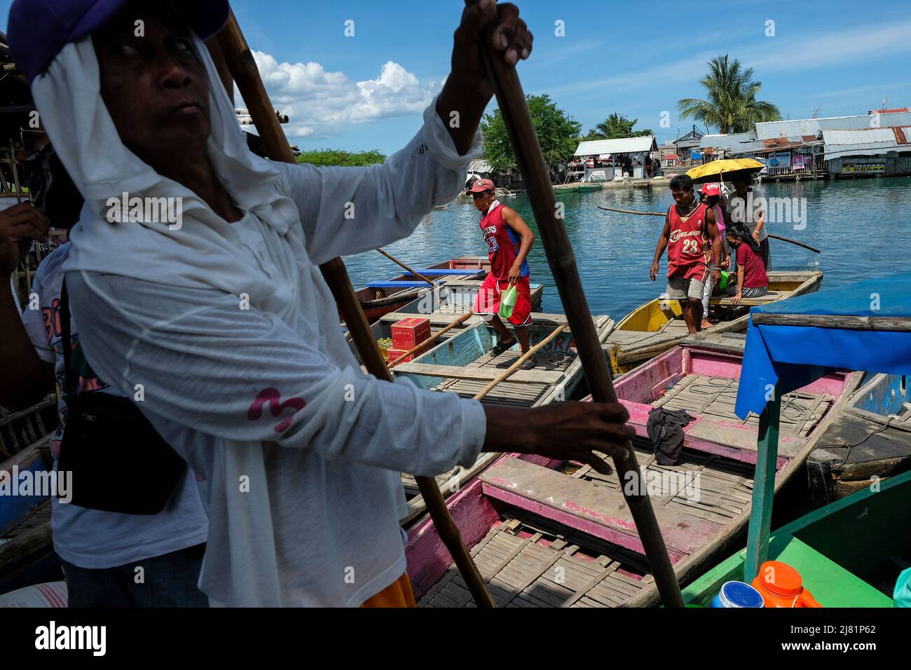 San Jose, Philippines - May 2022: People crossing the Pandurucan River ...