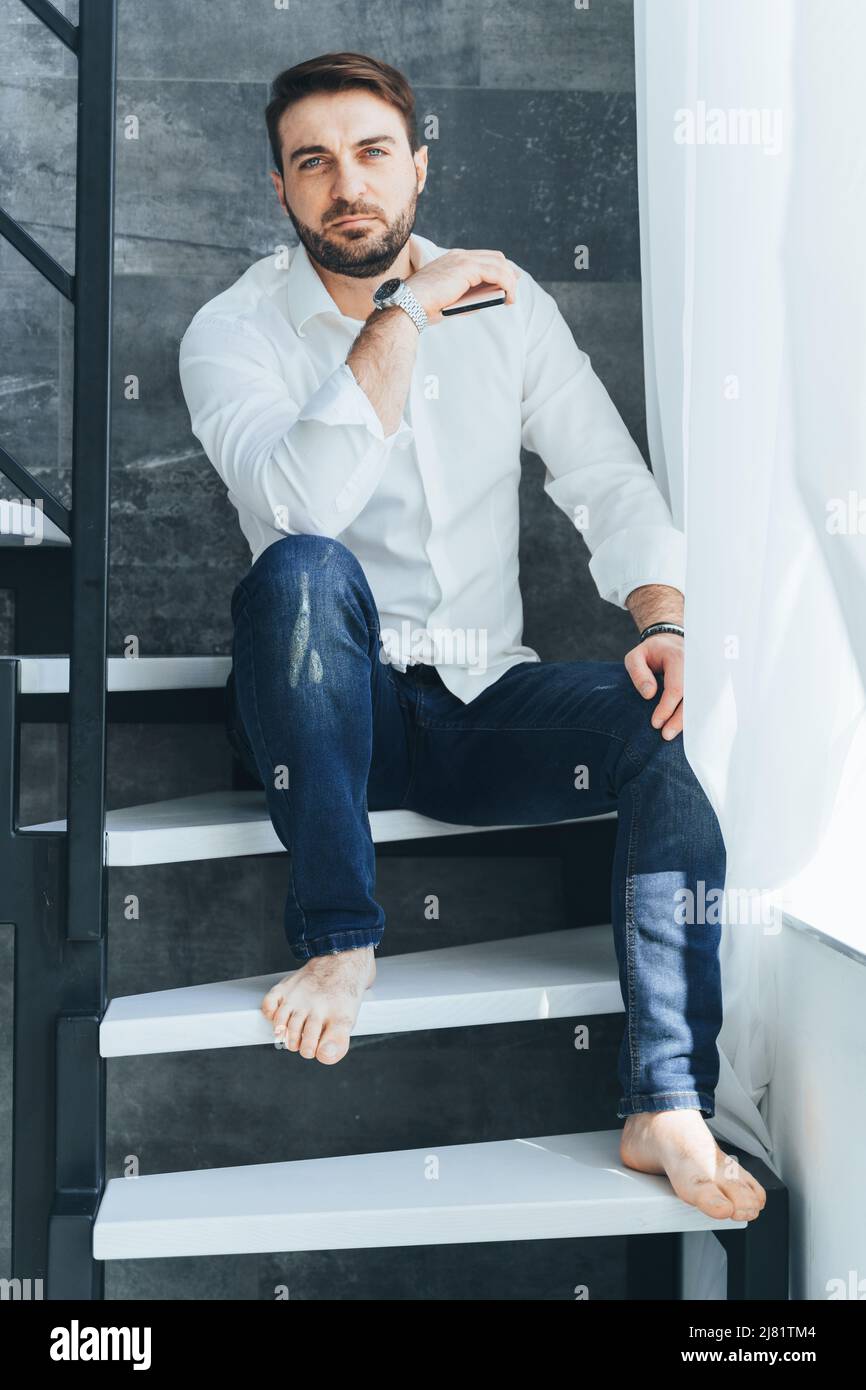 Vertical image of handsome professional bearded man with blue eyes ...
