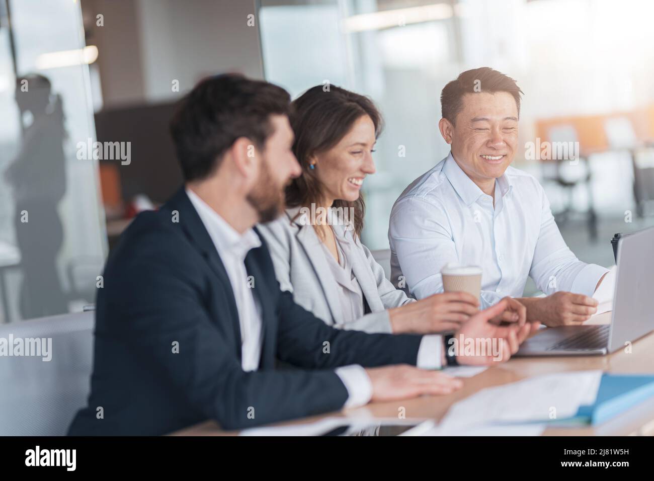 Positive business team working on new project in modern office Stock ...