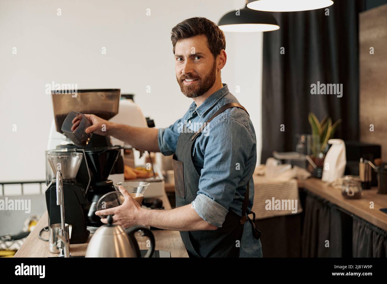 Man making coffee powder hi-res stock photography and images - Alamy