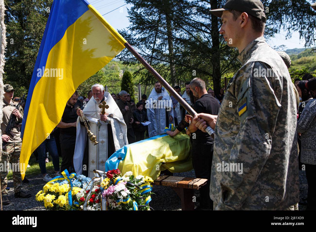 Zakarpatti, Ukraine. May 11, 2022, A priest conducts a funeral ceremony ...