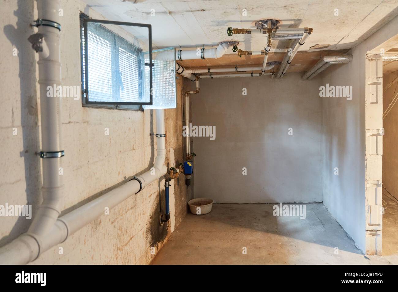 Ventilating a damp boiler room with a cellar window after a pipe burst ...