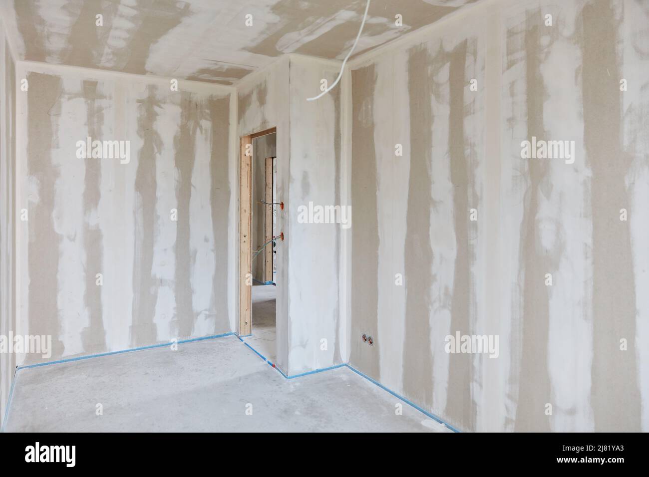 Interior finishing of room with door after filling work in a new house ...