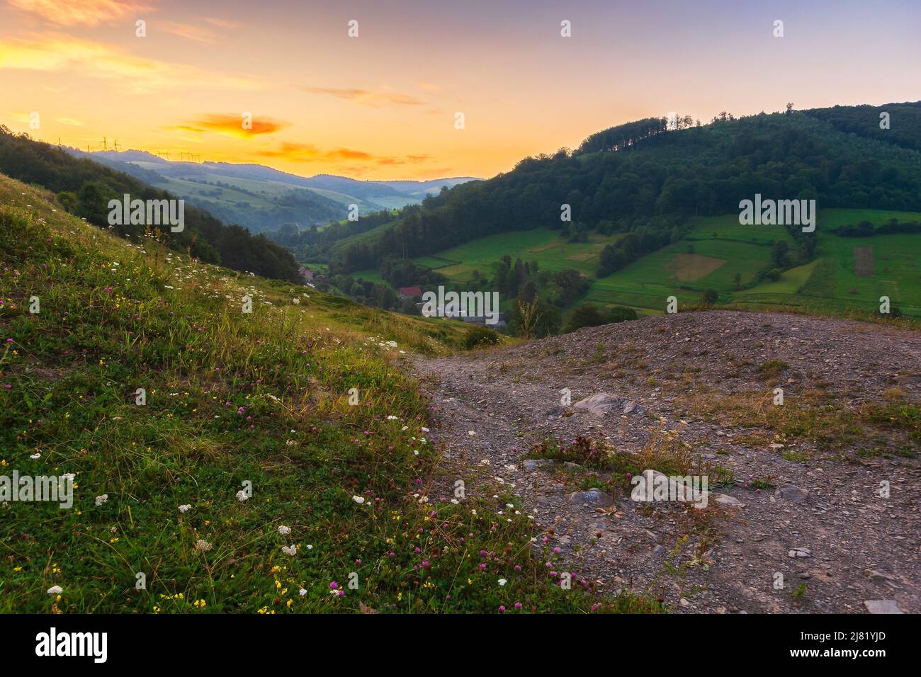 mountainous countryside landscape at dawn. rural fields on the hills ...