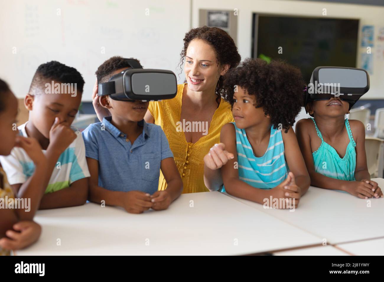 Young female caucasian teacher with african american elementary ...