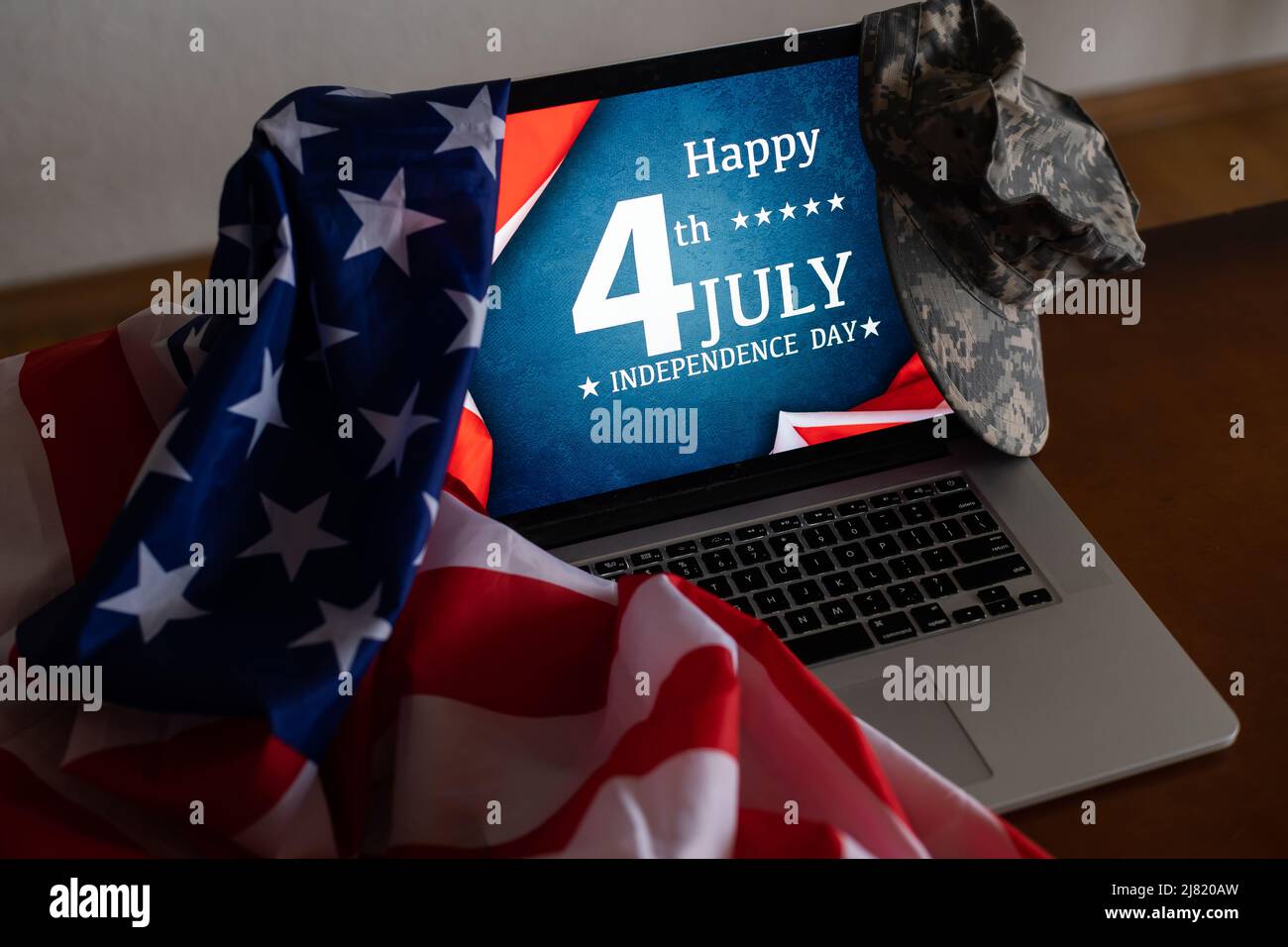 laptop with Inscription Happy independence day on usa flag Stock Photo ...