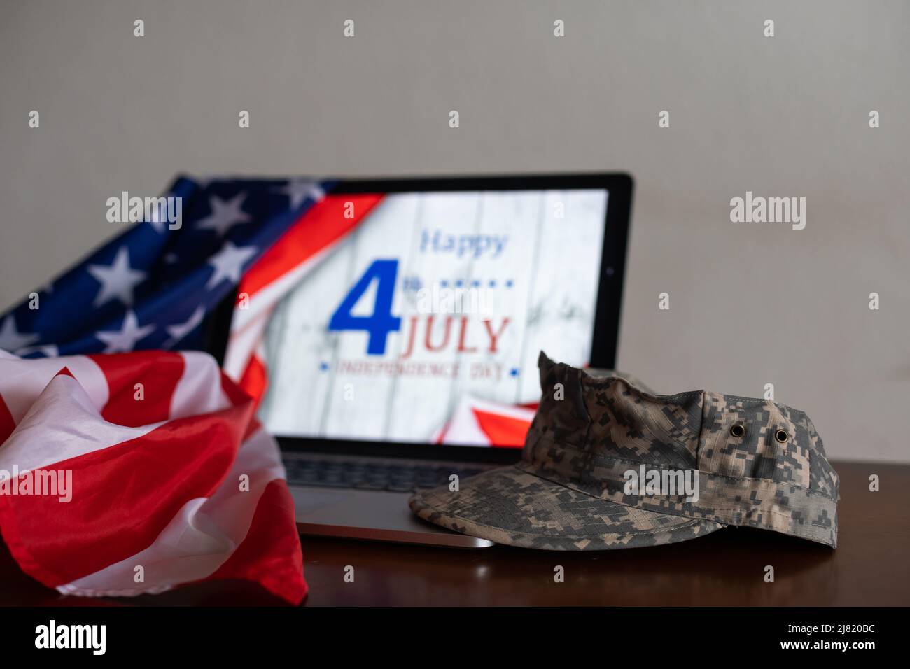 laptop with Inscription Happy independence day on usa flag Stock Photo ...