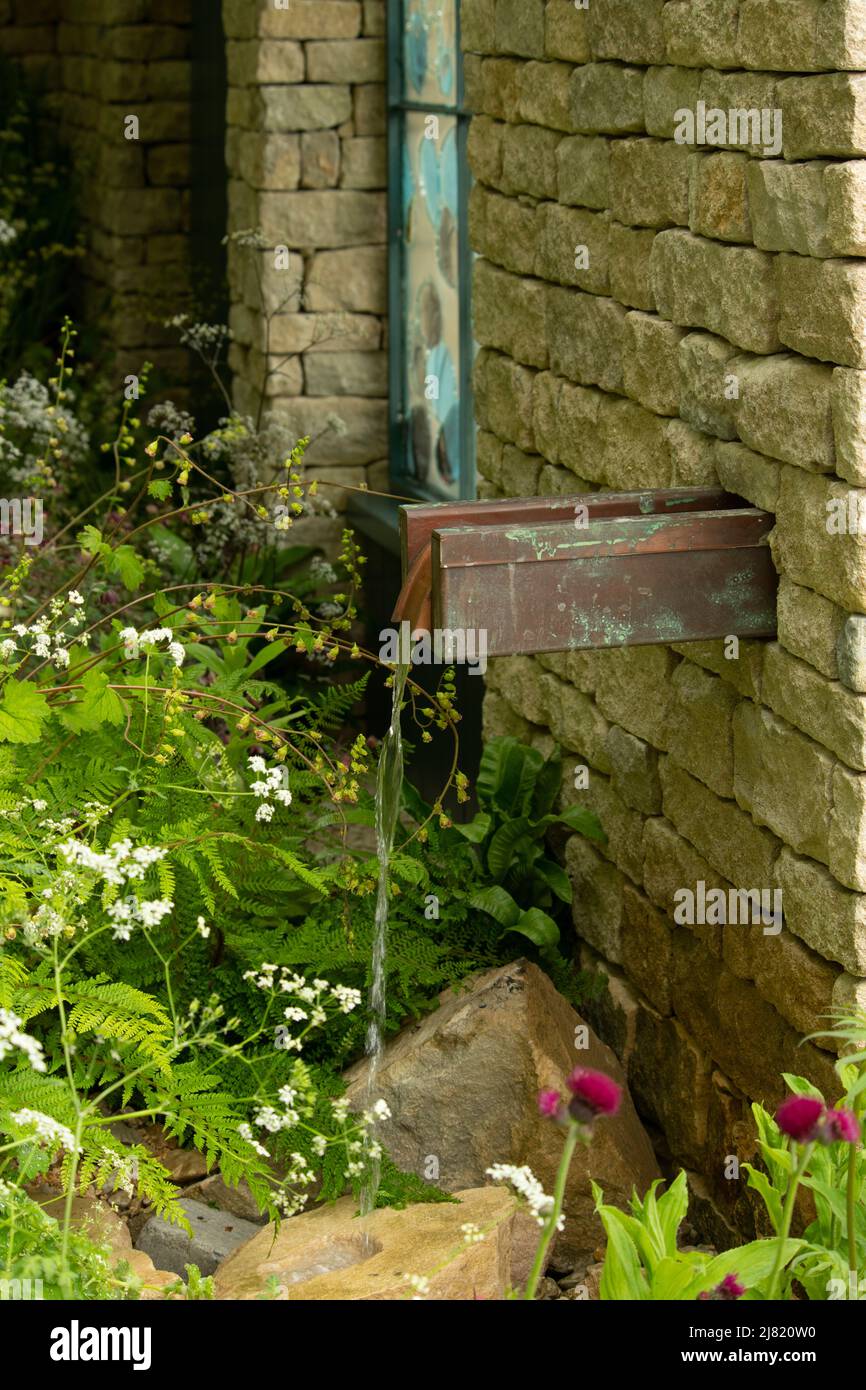 A water feature in the Warner’s Distillery Gin Garden at the RHS ...