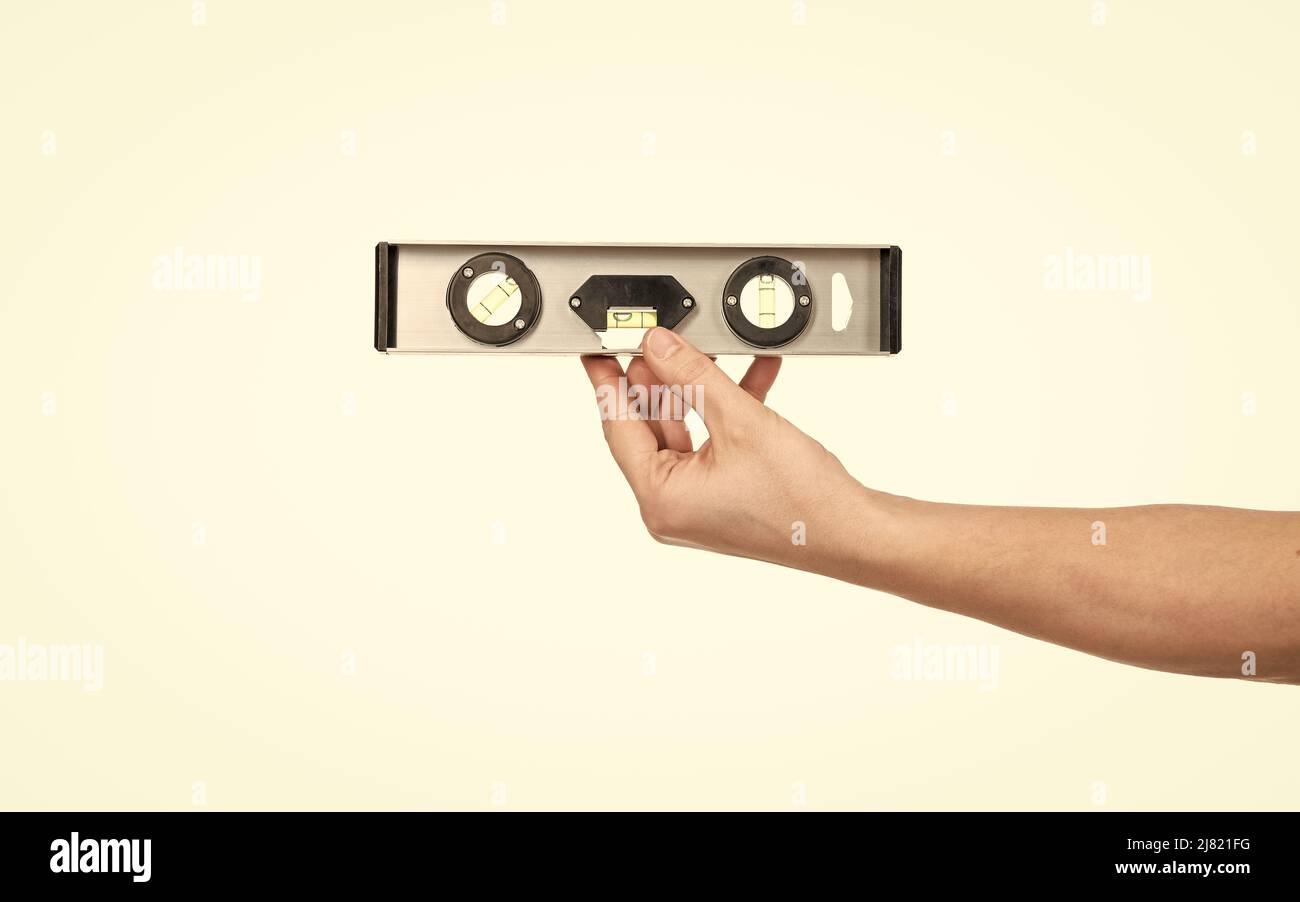 building level in hand isolated on white background, measurement Stock ...