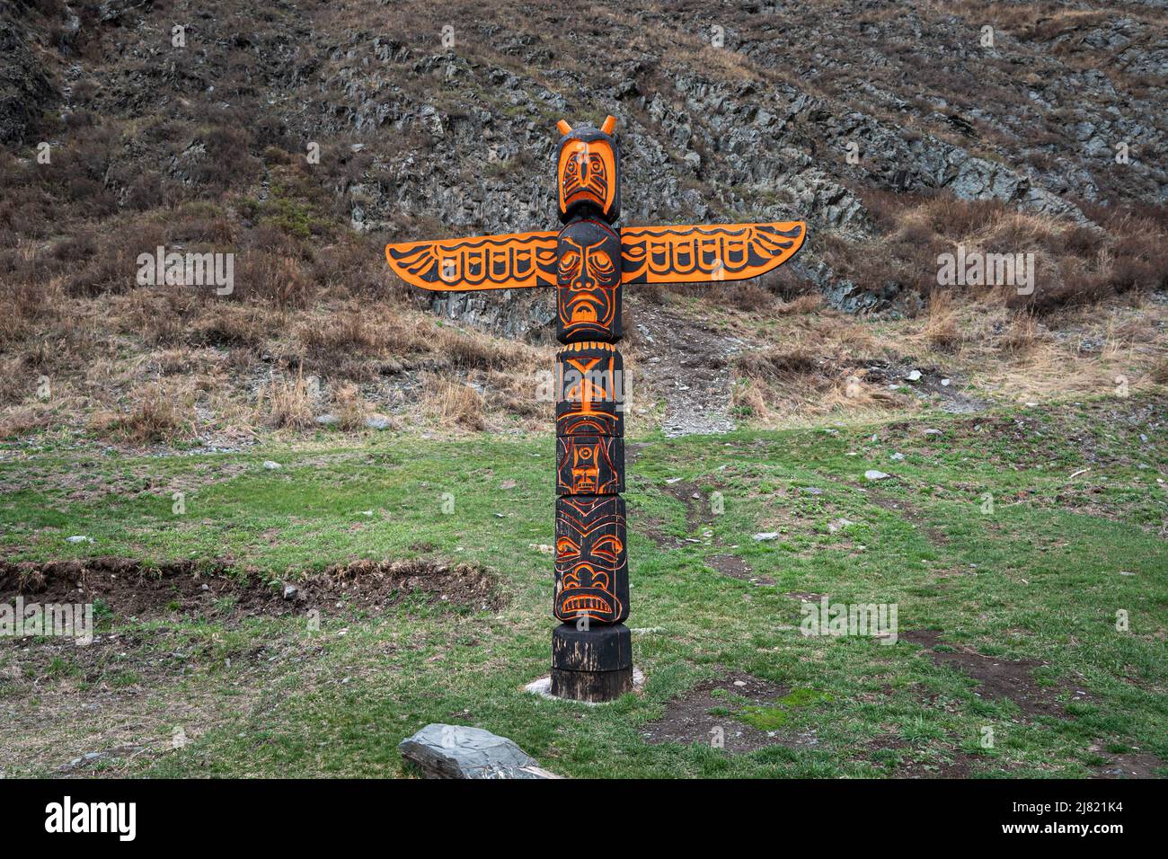 Totem pole with eagle and wings against the background of nature Stock ...