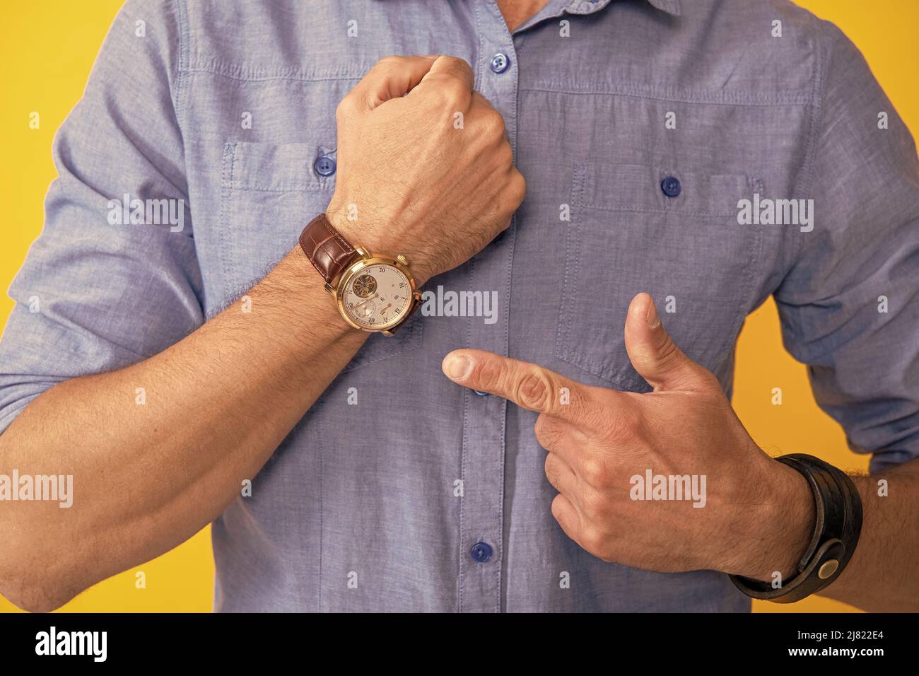 Hand pointing to time hi-res stock photography and images - Alamy