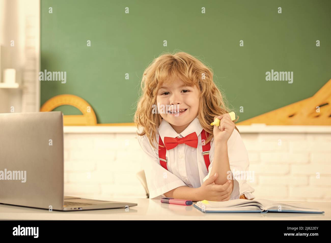 knowledge day. concept of education. nerd kid with long hair at ...