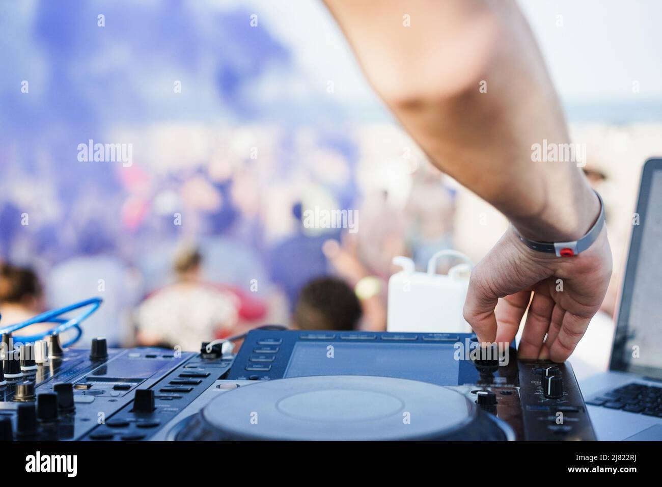 Dj mixing at beach party during summer vacation outdoor - Focus on ...