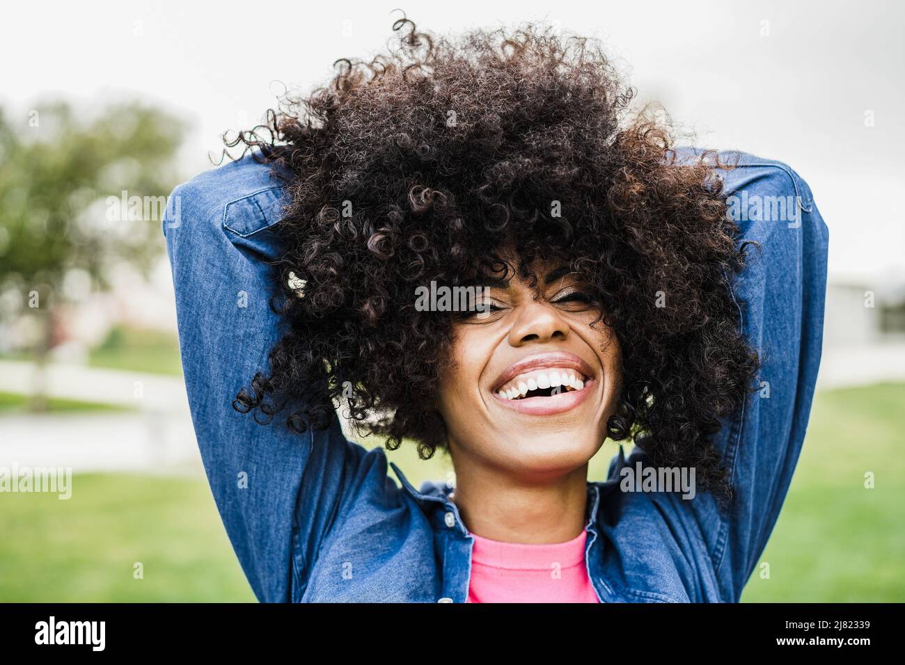 Happy african girl smiling on camera outdoor - Focus on face Stock ...