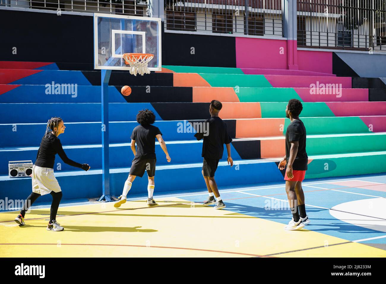 African friends playing basketball outdoor - Focus girl face Stock ...