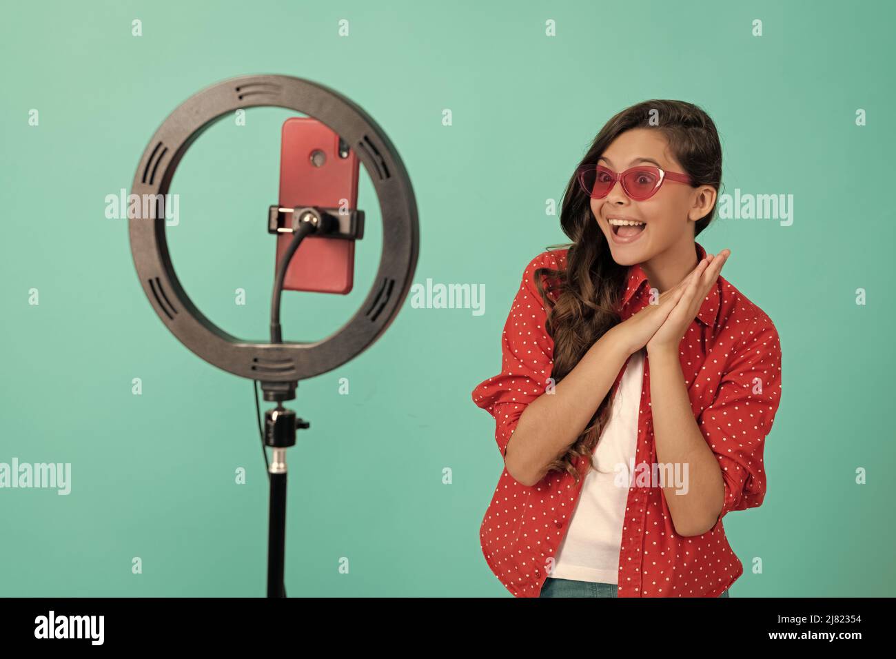 making video blog on smartphone. blogging light lamp. influencer ...