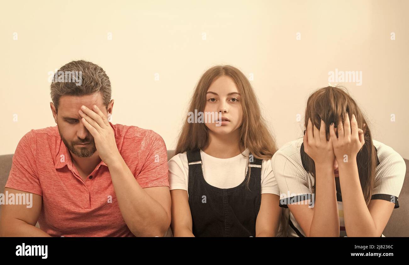 sad child between mother and father. family therapy. parents with kid ...