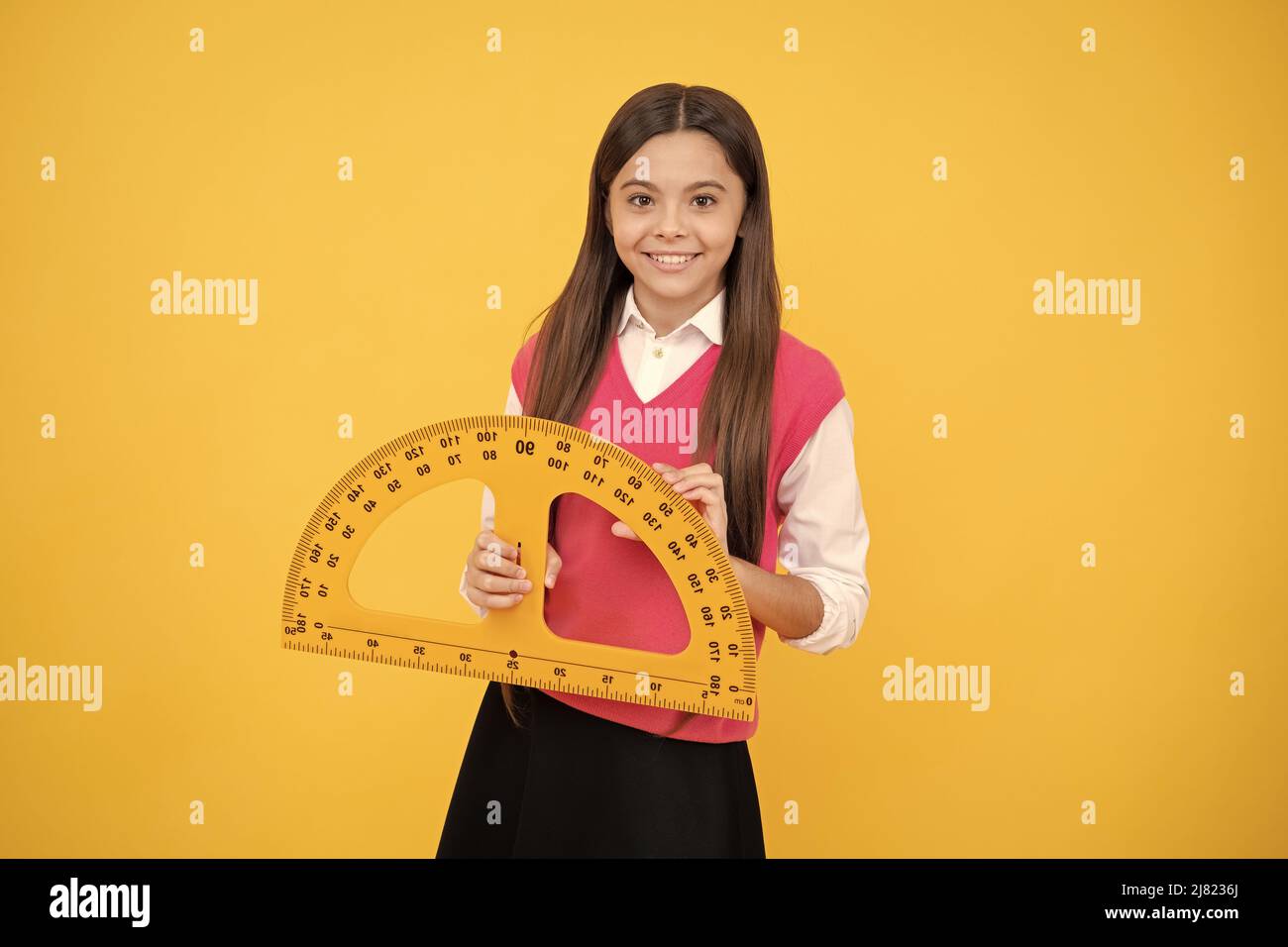 Educational concept. measurement. happy teenage girl with protractor ...