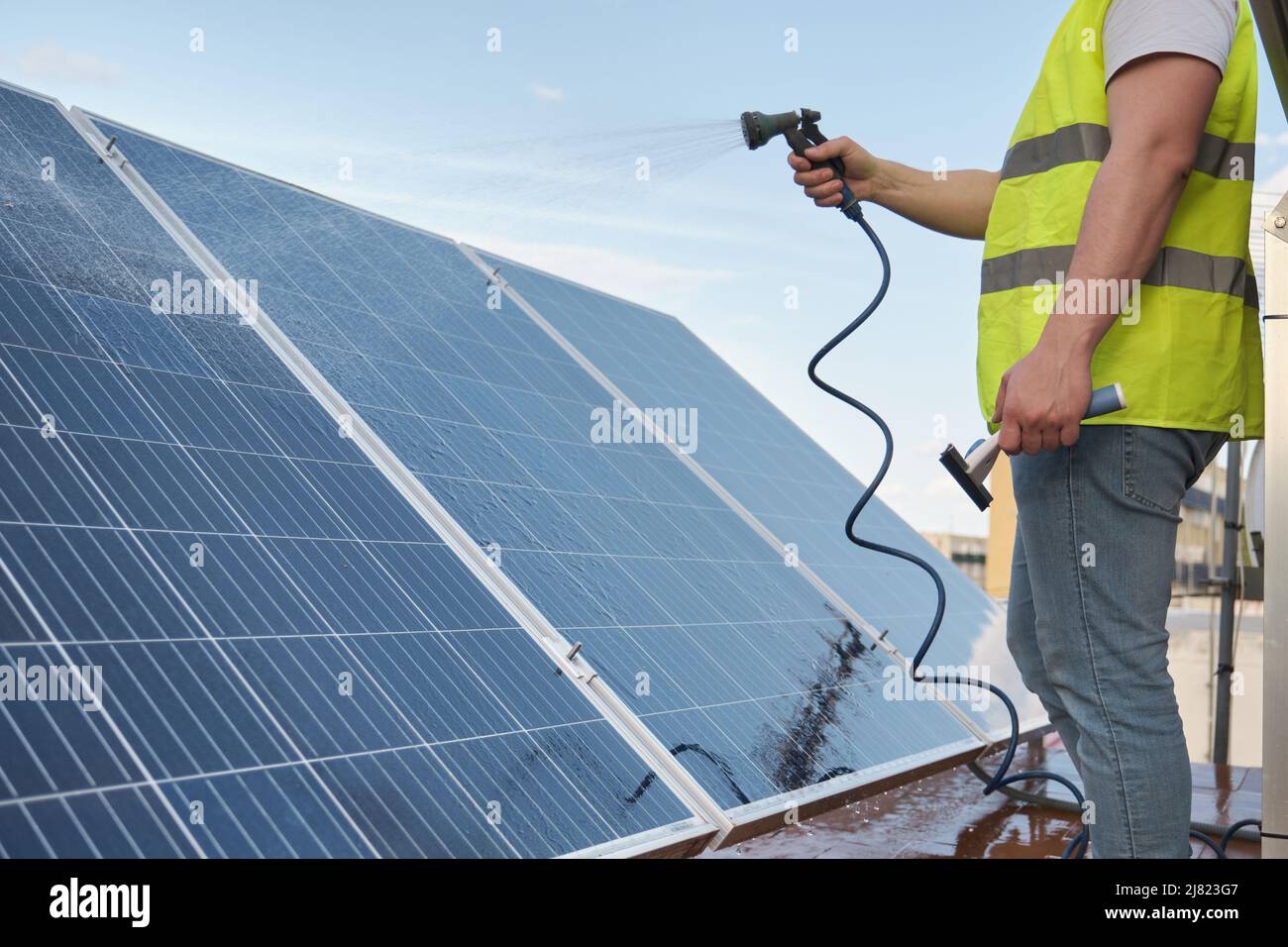 Technician cleaning solar panels hi-res stock photography and images ...