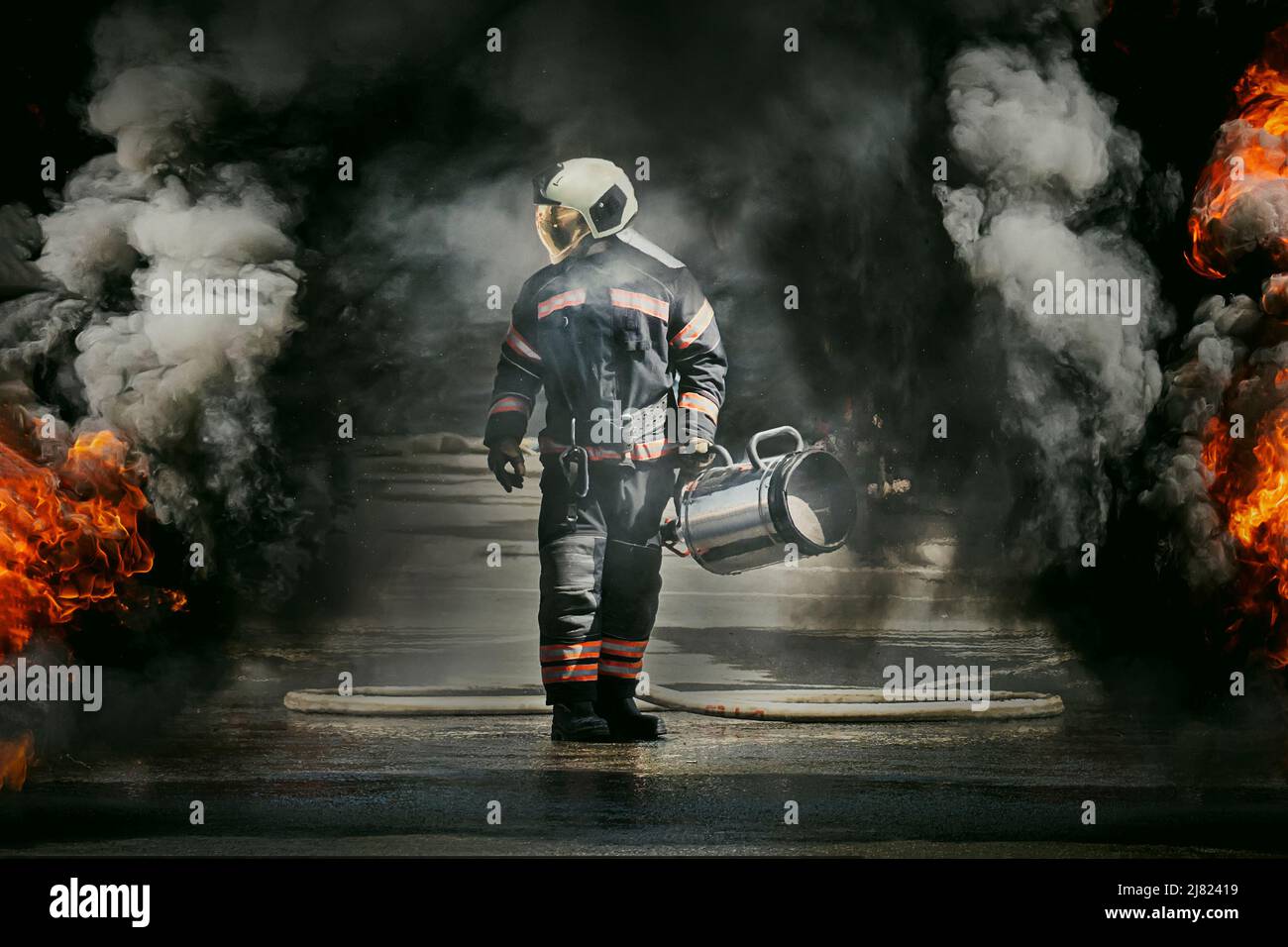 Firefighter wearing a fire suit for safety under the danger case. A ...