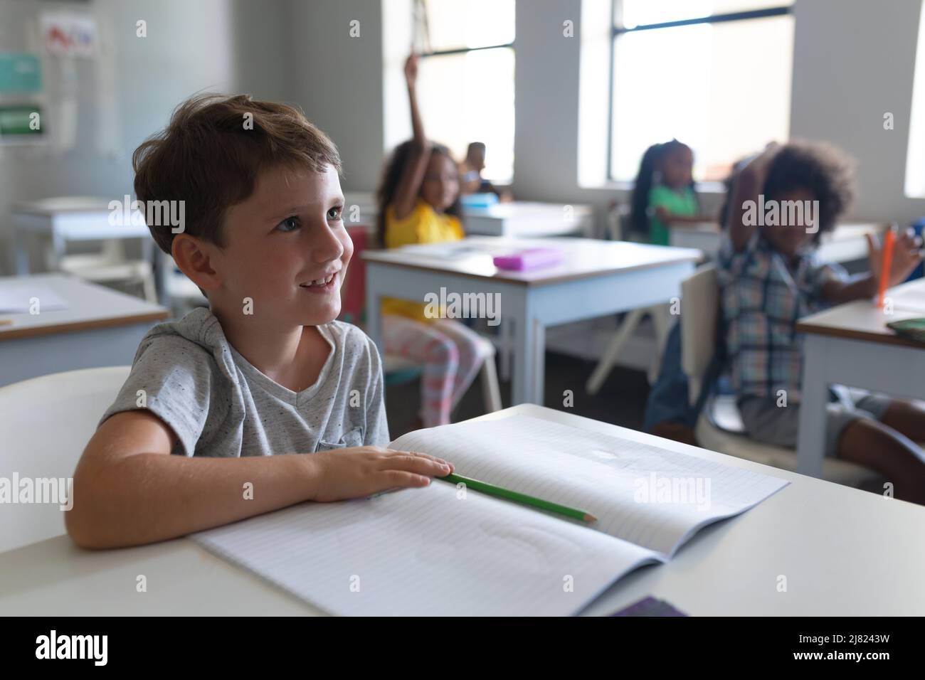 Teacher smiling children in library hi-res stock photography and images ...