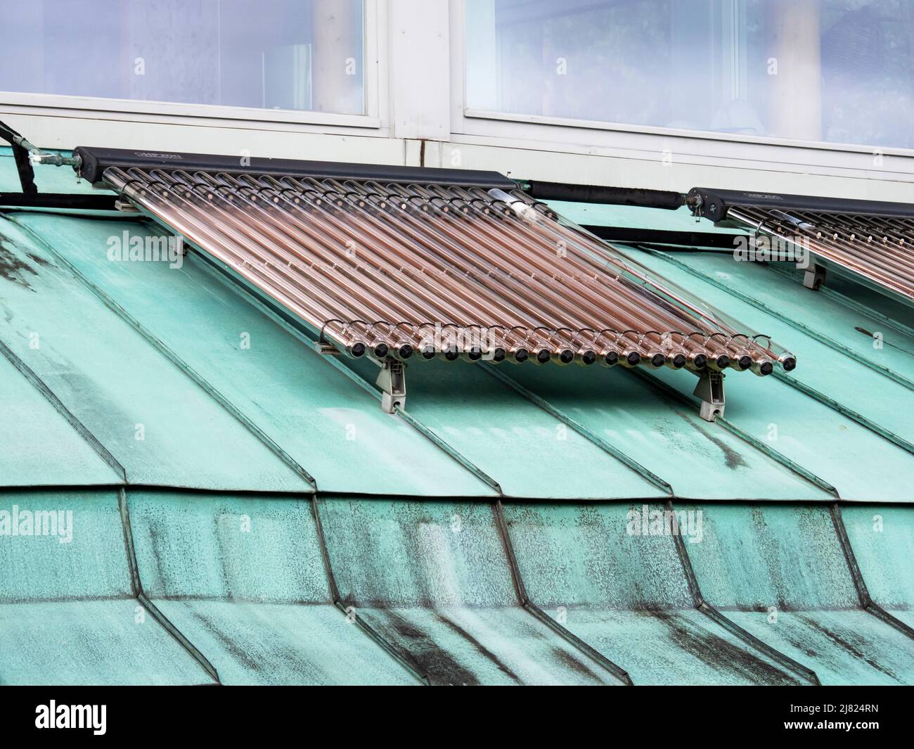 A solar thermal panel on a copper roof at Harlow Carr Gardens ...