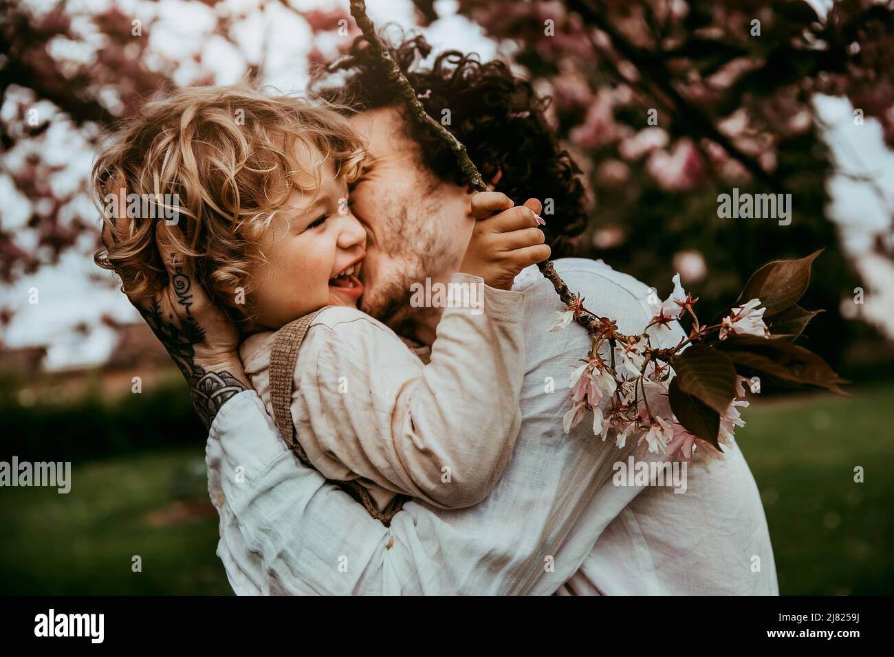 Family blossom photography father and son Stock Photo - Alamy