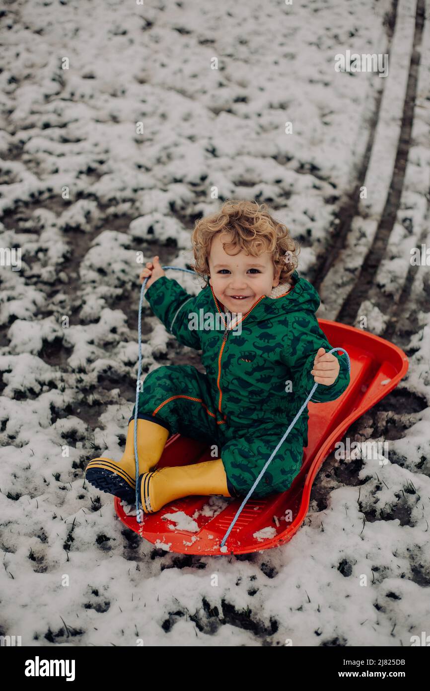 Happy child sleding hi-res stock photography and images - Alamy