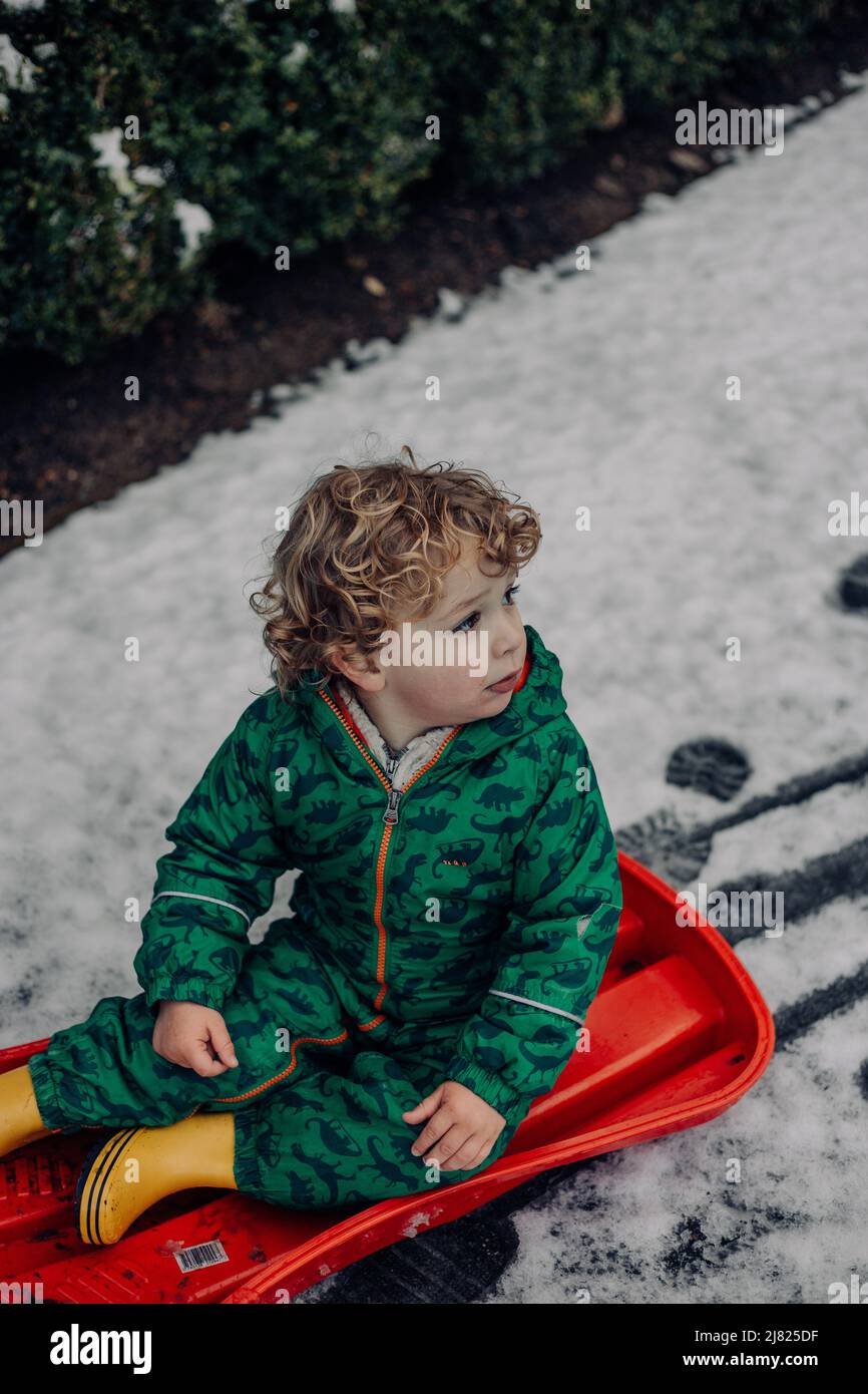 Happy child sleding hi-res stock photography and images - Alamy