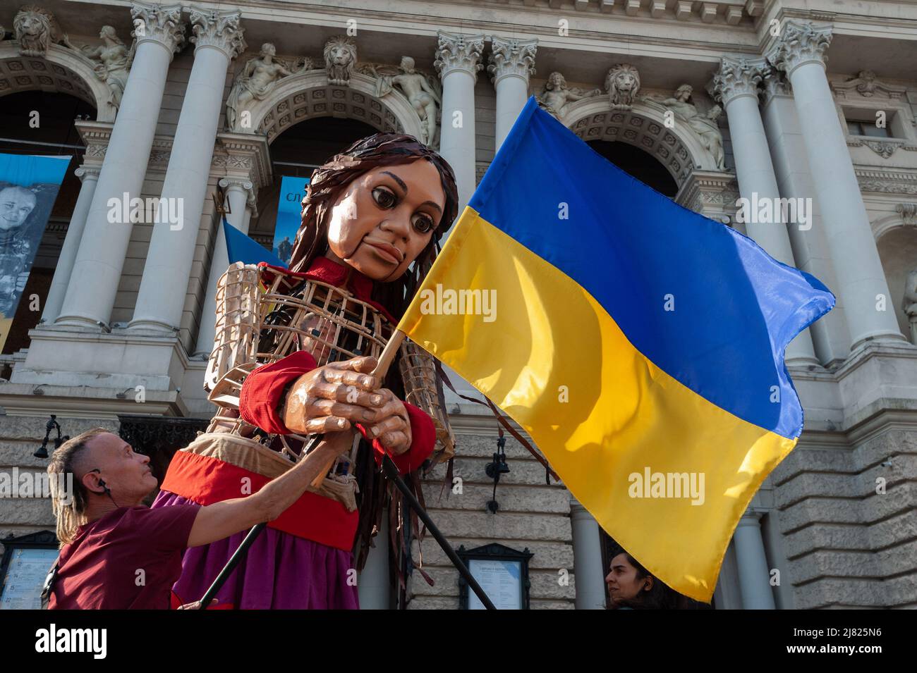 Amal, a giant puppet representing a nine-year-old Syrian refugee girl ...