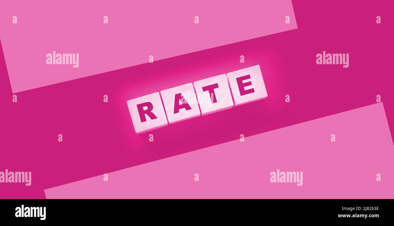 Rate word concept written on wooden cubes blocks lying on a black ...
