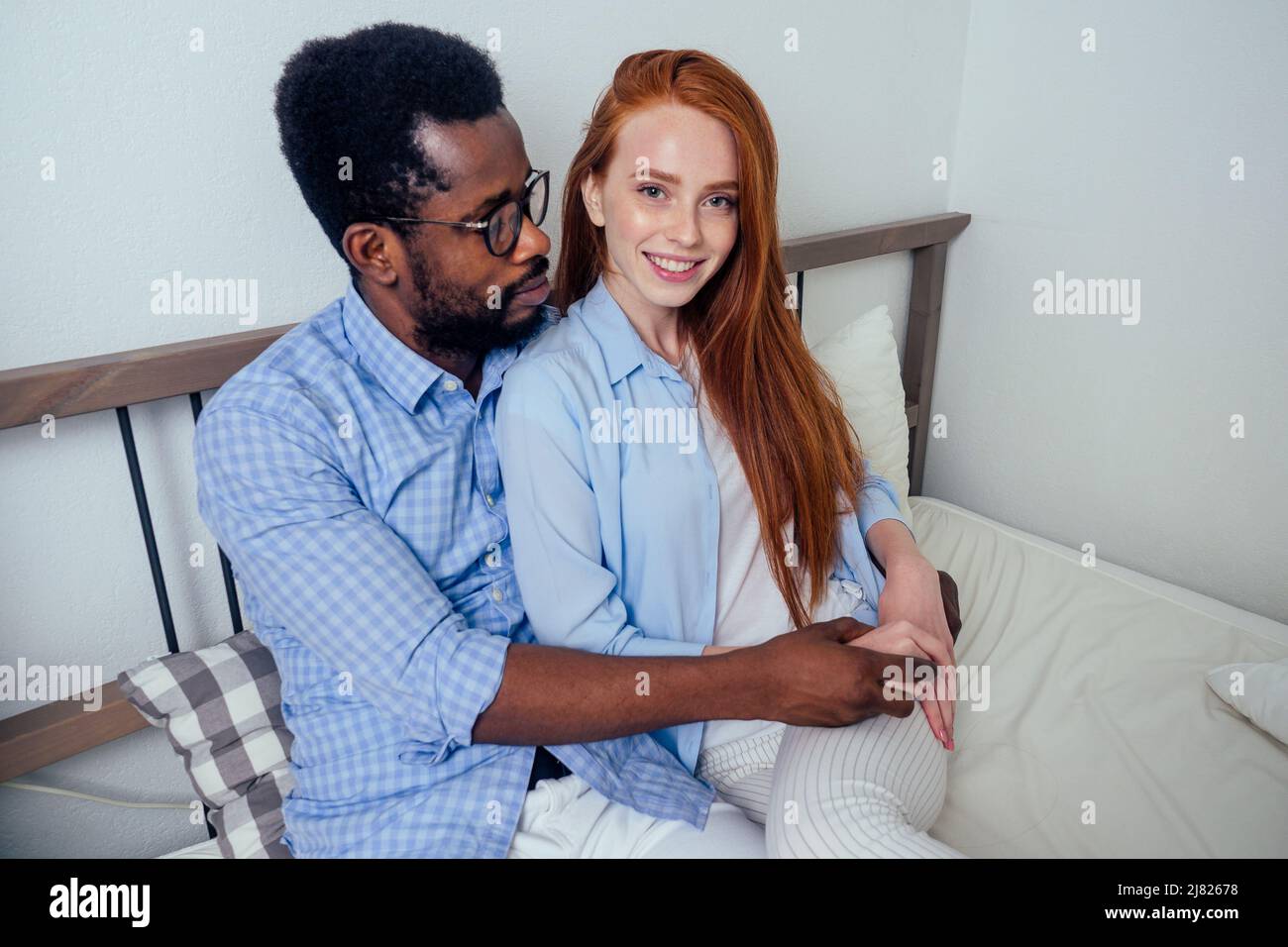 ginger hair european female and handsome afro african male together ...