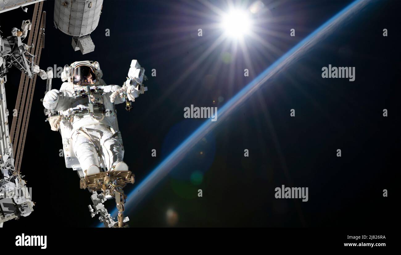 Astronaut in outer space over the planet Earth. Our home. ISS. Elements of this image furnished ...