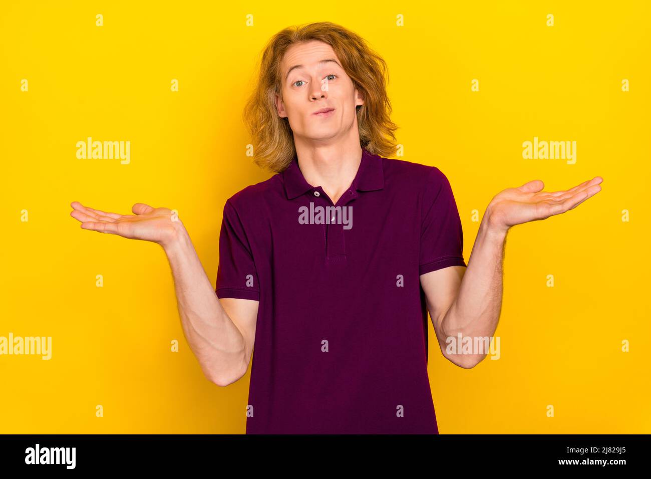 Photo of young nice man raise arms palms shrug shoulders isolated on ...