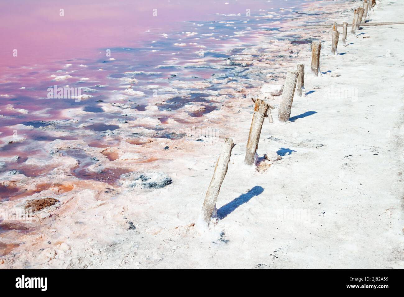 Path in salt with wood pegs Stock Photo - Alamy