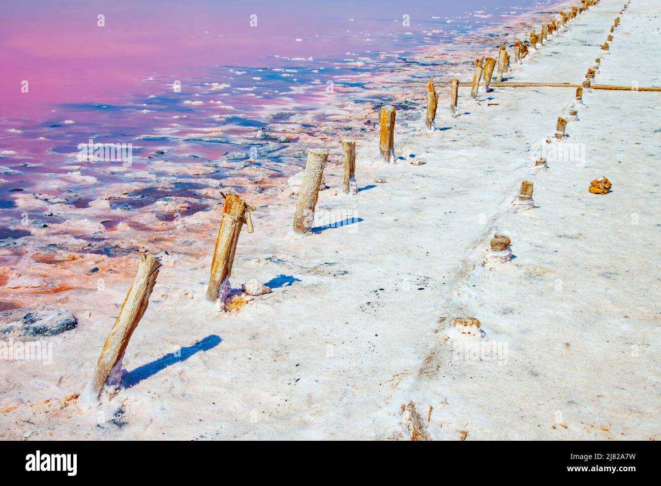 Path in salt with wood pegs Stock Photo - Alamy