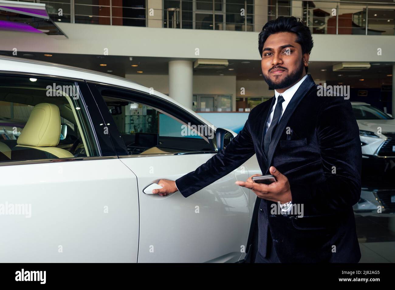 Rich indian businessman in formal wear drive car Stock Photo - Alamy