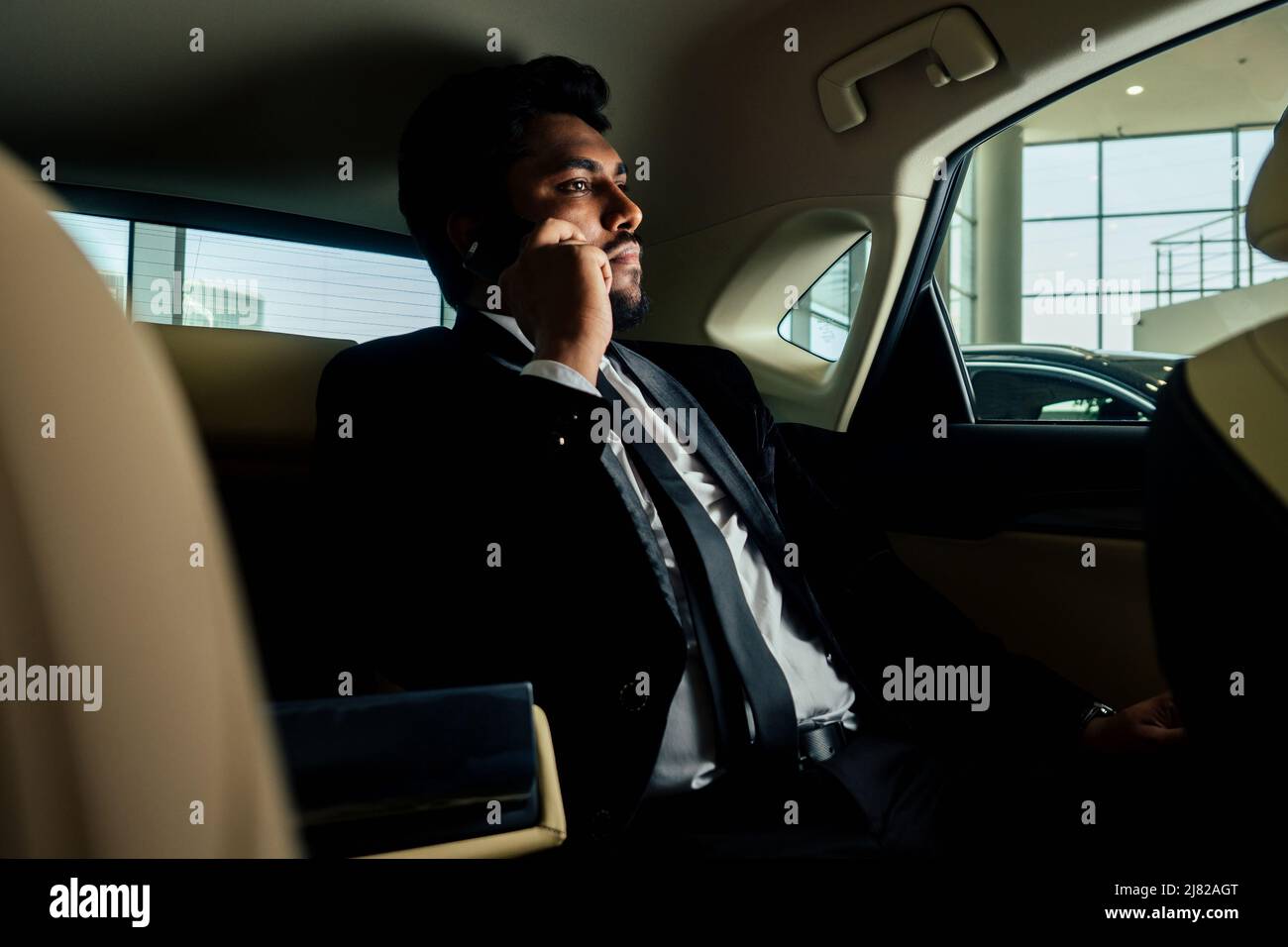 Rich indian businessman in formal wear drive car Stock Photo - Alamy