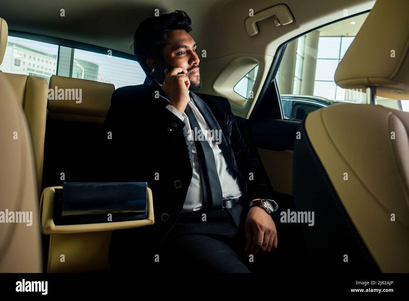 Rich indian businessman in formal wear drive car Stock Photo - Alamy