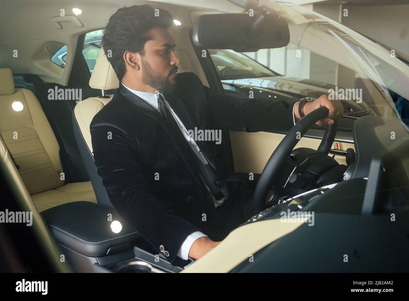 Rich indian businessman in formal wear drive car Stock Photo - Alamy
