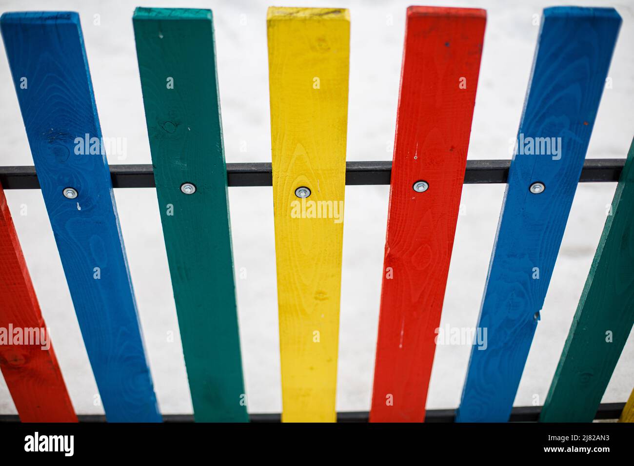 Colorful wooden fence on a white background Stock Photo - Alamy