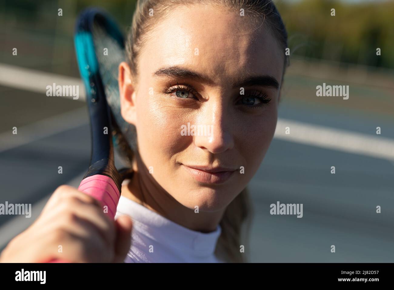 Close-up portrait of beautiful young caucasian female tennis player ...