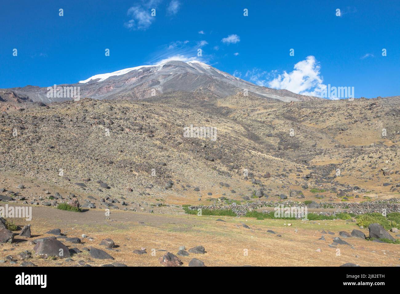 The ice cap on the summit of the snow-capped and dormant compound ...