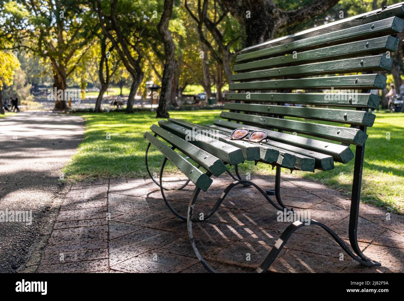 Benches within the grounds of Hyde Park, an inner-city public open ...