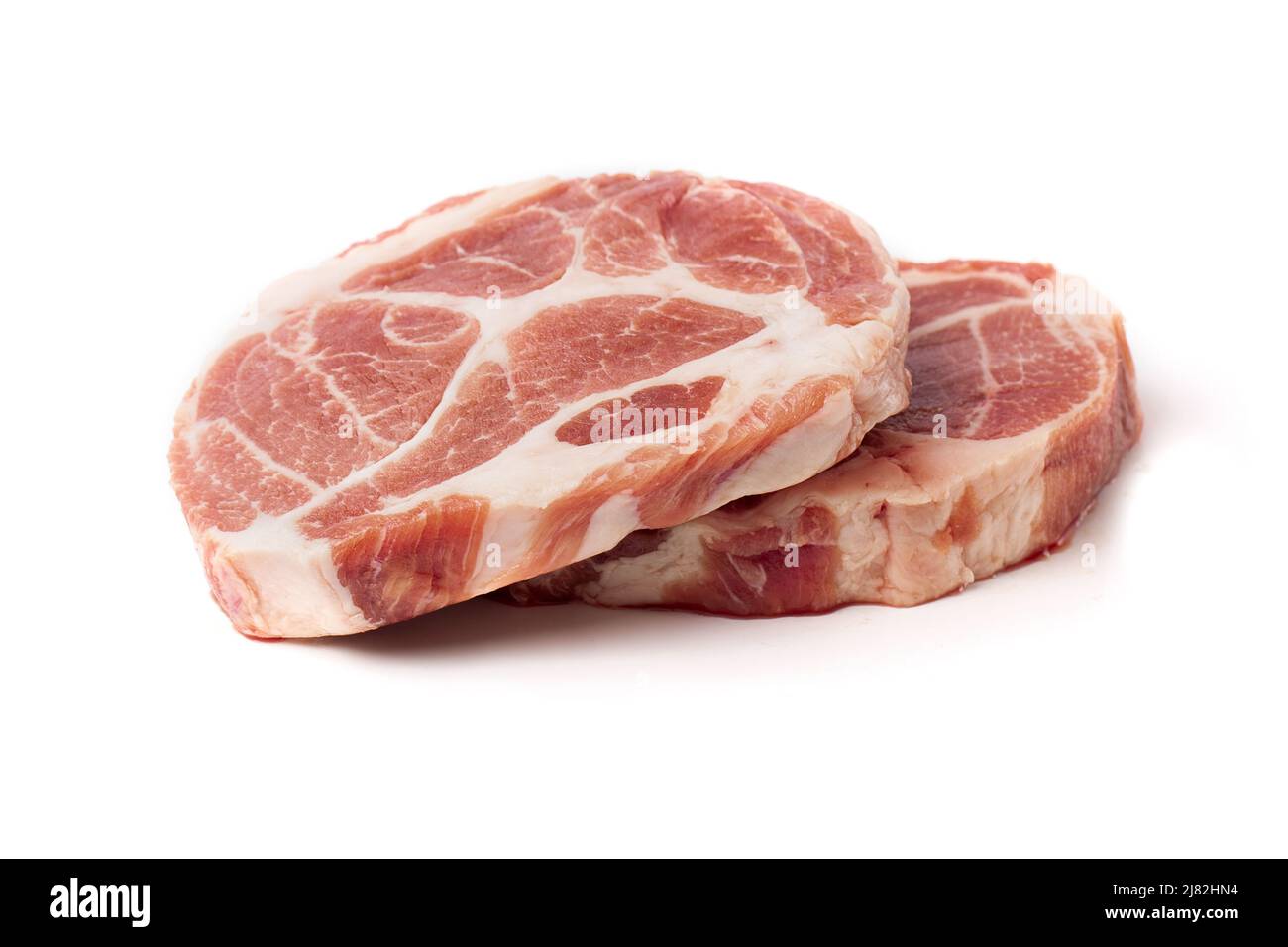 Steaks of raw marbled pork tenderloin on a white background Stock Photo ...