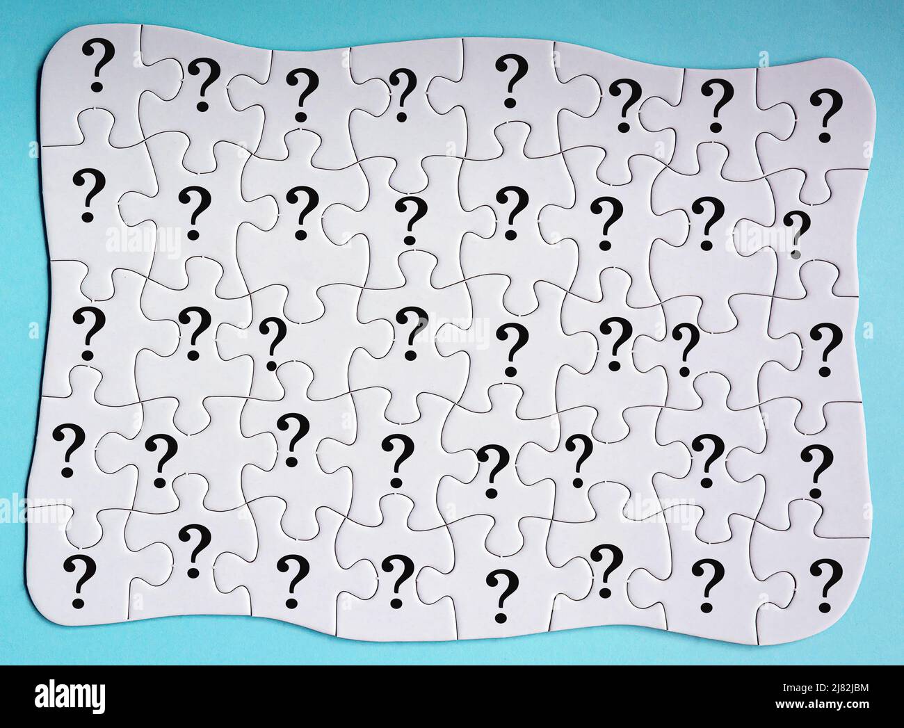 Set of 40 puzzle pieces with question mark isolated on blue background ...
