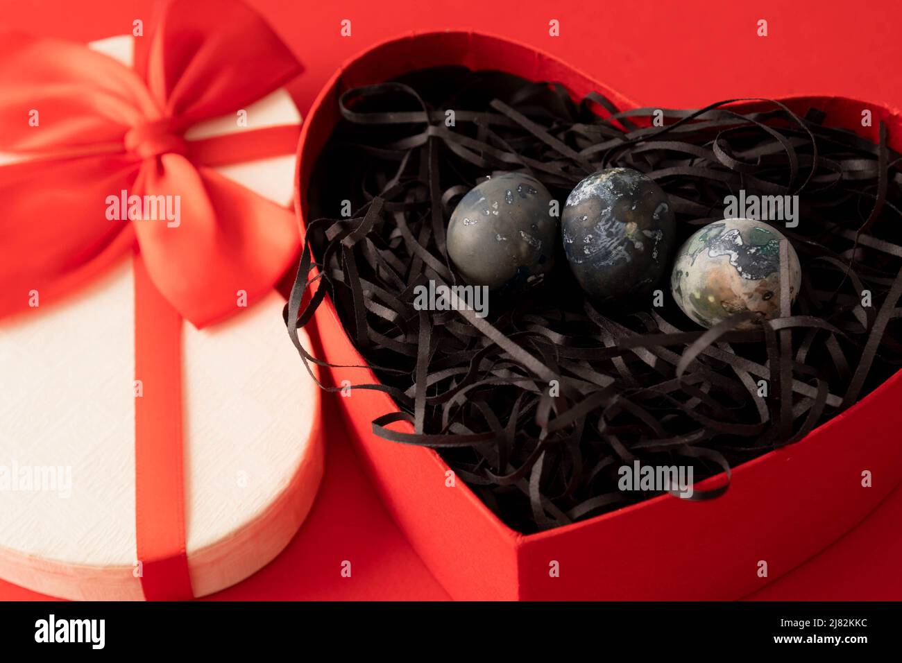 Naturally colored eggs in a red gift box. A Easter Eggs as a symbol of ...