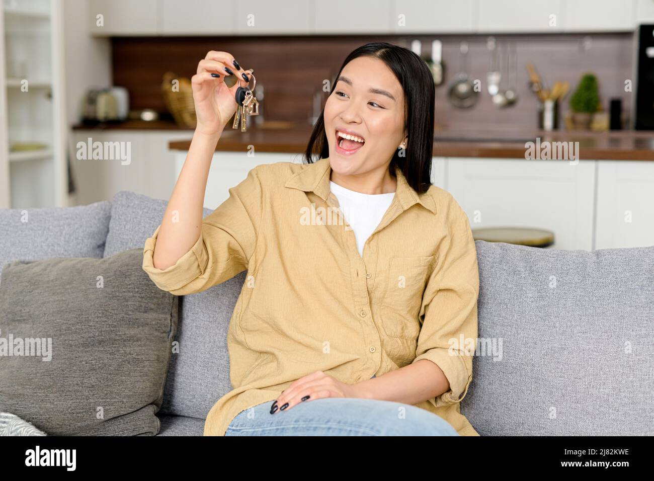 Relocation concept. Excited lady moving in new home or apartment ...