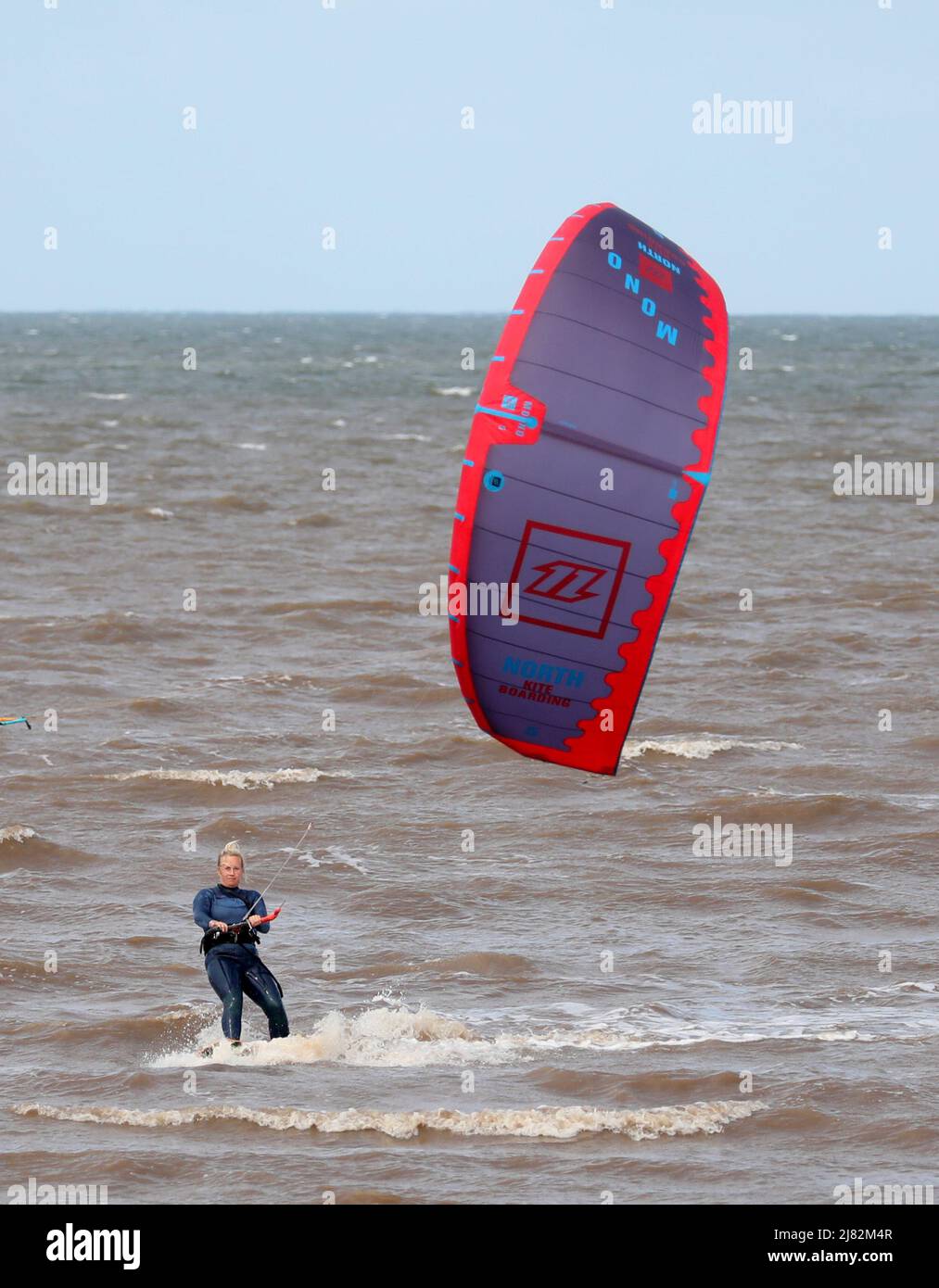 Heacham, UK. 10th May, 2022. Kitesurfers enjoying the strong winds at ...